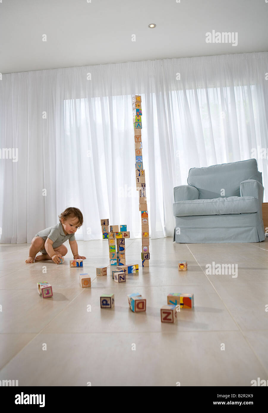 Baby boy stacking blocks hi-res stock photography and images - Alamy