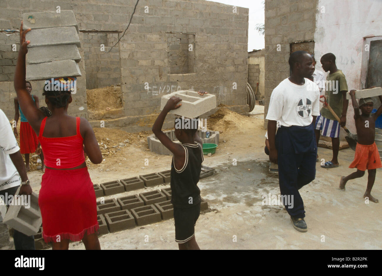Villagers helping out at construction site, Luanda, Angola, Africa ...