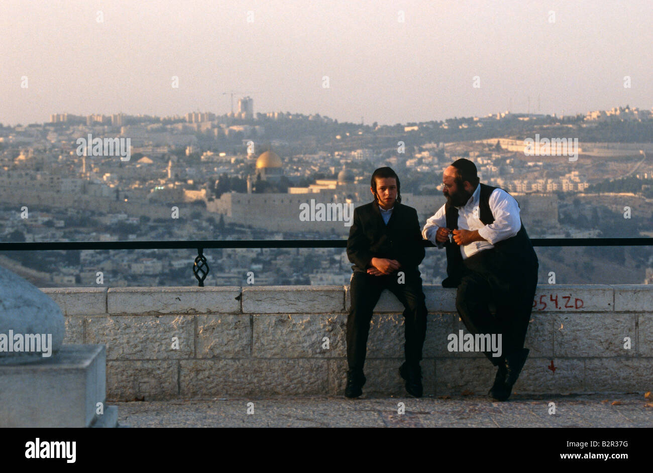 Jewish men talking with Jerusalem cityscape backdrop, Israel, Middle ...