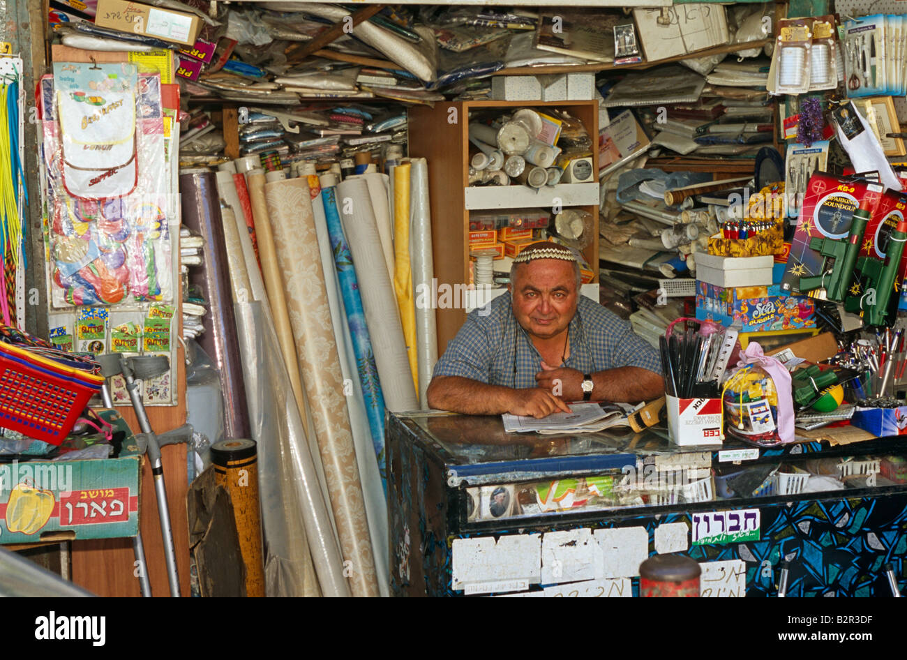 Male shopkeeper at shop counter, portrait, Israel, Middle East Stock ...