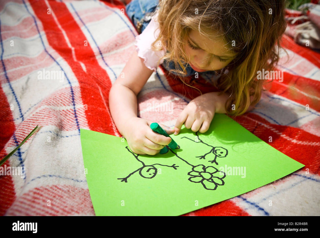 Girl colouring a drawing Stock Photo - Alamy