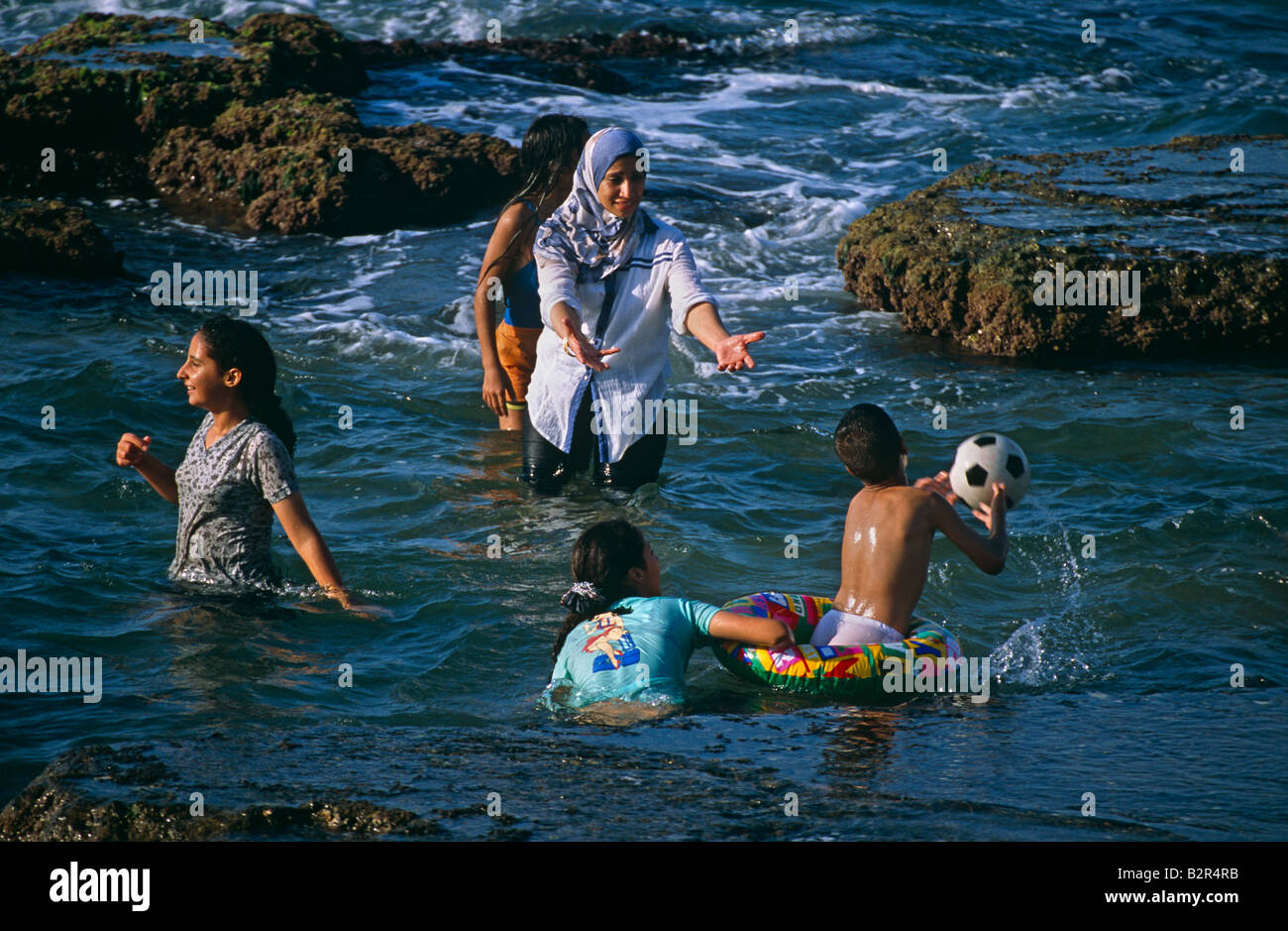 Family playing on the beach in Beirut, Lebanon Stock Photo - Alamy