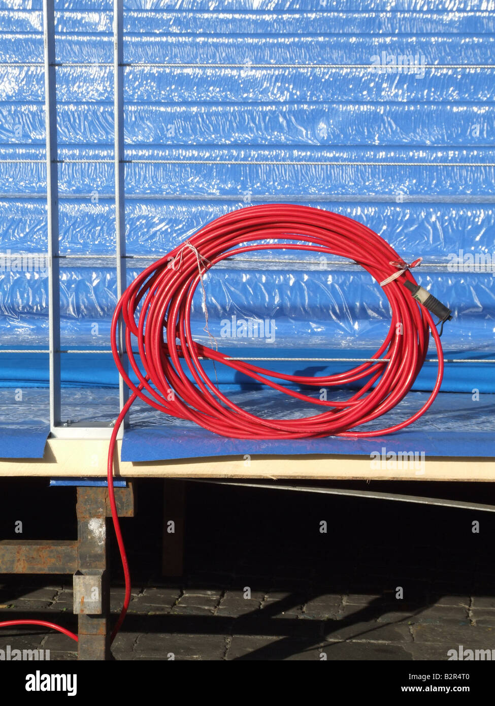 blue steps with plastic cover and red cable coil Stock Photo - Alamy