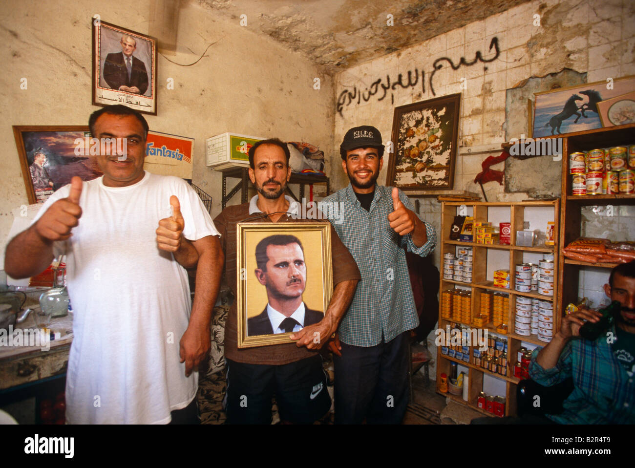 Men with a portrait of Syrian President Bashar al-Assad in Beirut ...