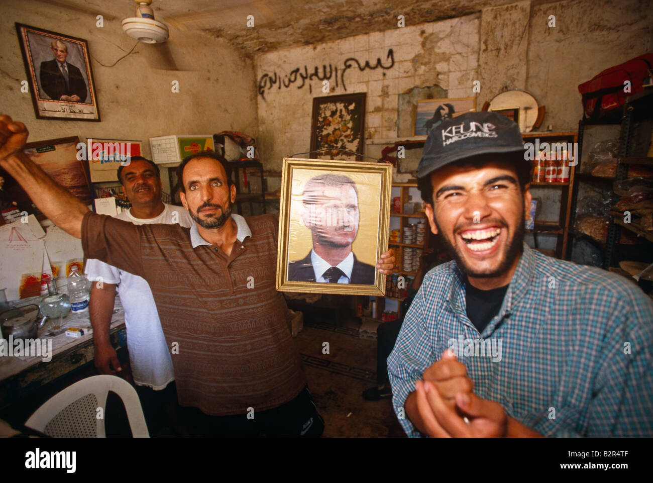 Men with a portrait of Syrian President Bashar al-Assad in Beirut ...