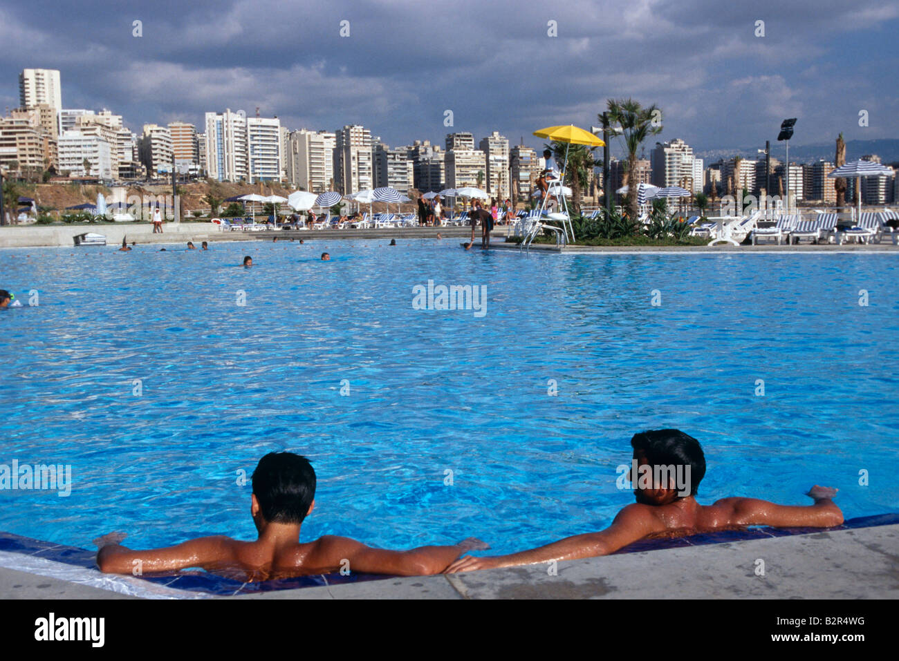 Men relaxing inoutdoor swimming pool, Beirut, Lebanon, Middle East ...