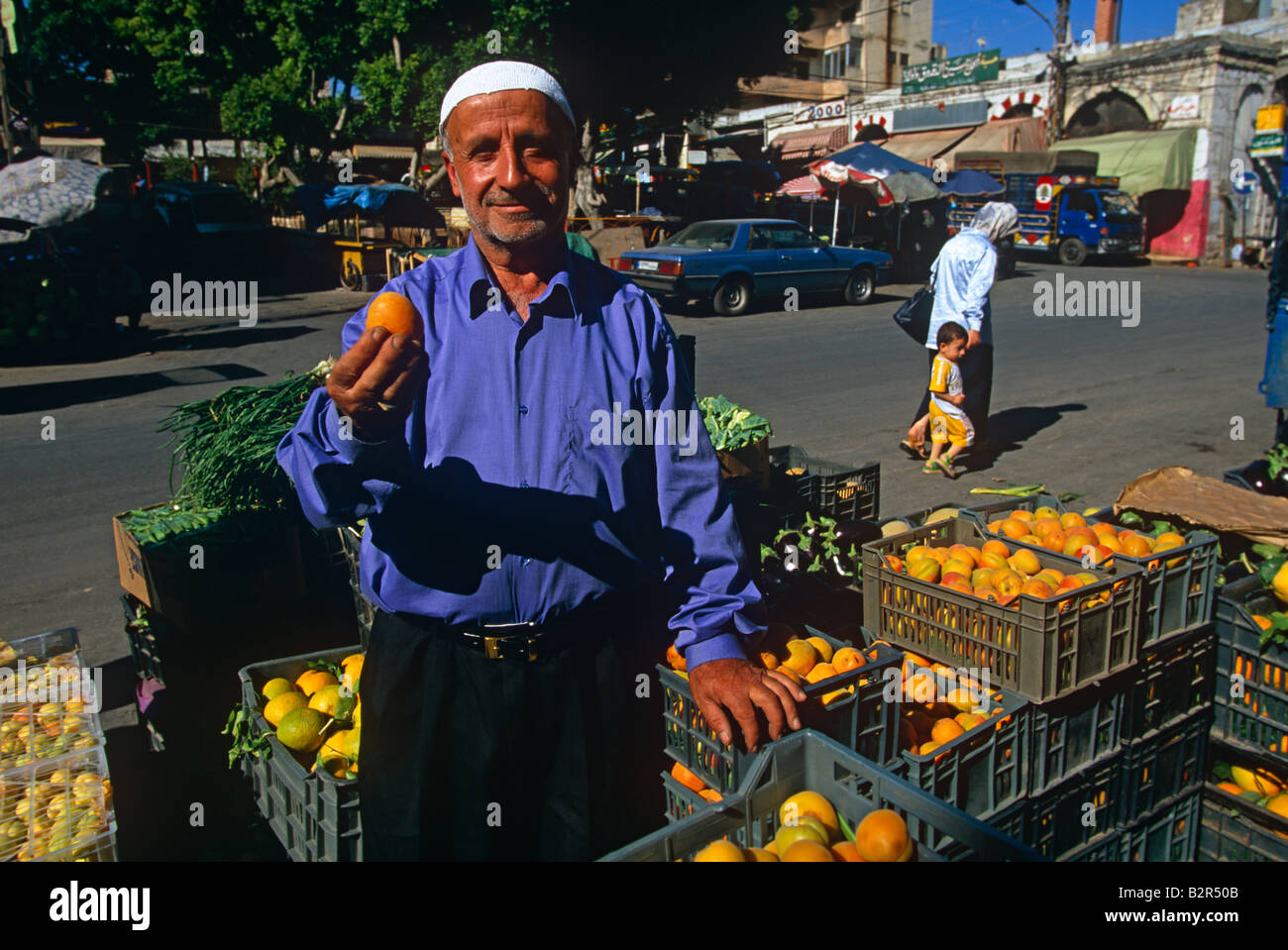Fruit vendor by abundant baskets of fruits, Lebanon Stock Photo - Alamy
