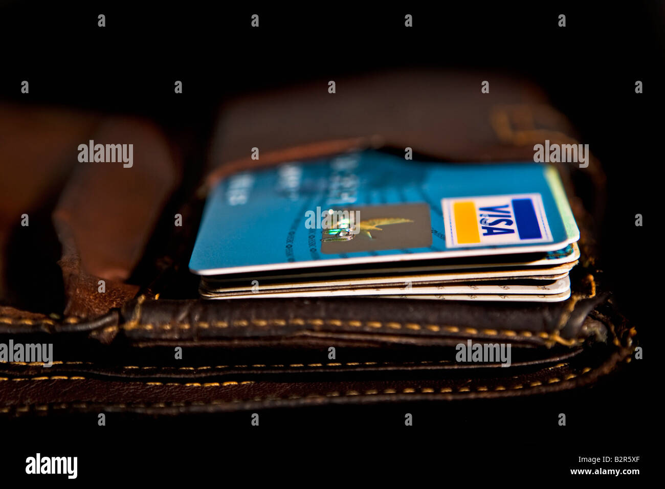 A Visa credit card in a leather wallet Stock Photo - Alamy