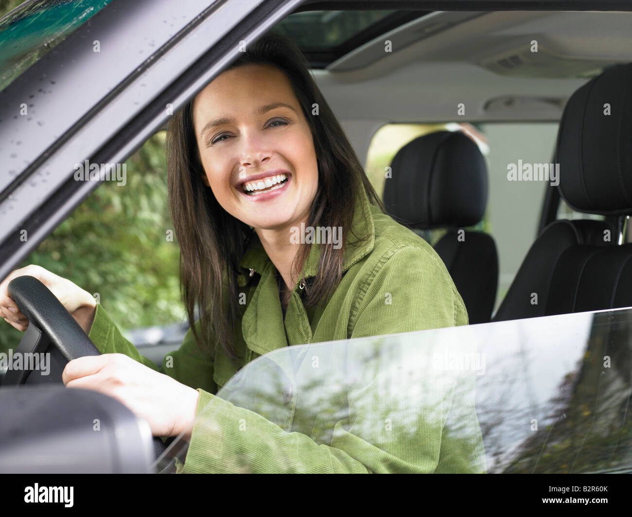 Woman in a car, smiling Stock Photo - Alamy