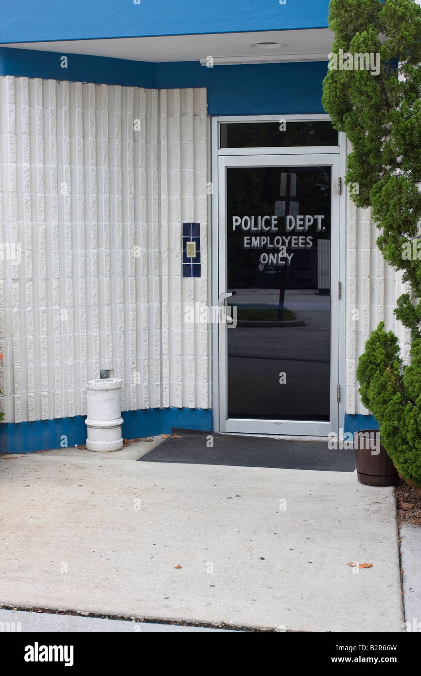 Police Department Employees Only Glass Door Stock Photo - Alamy