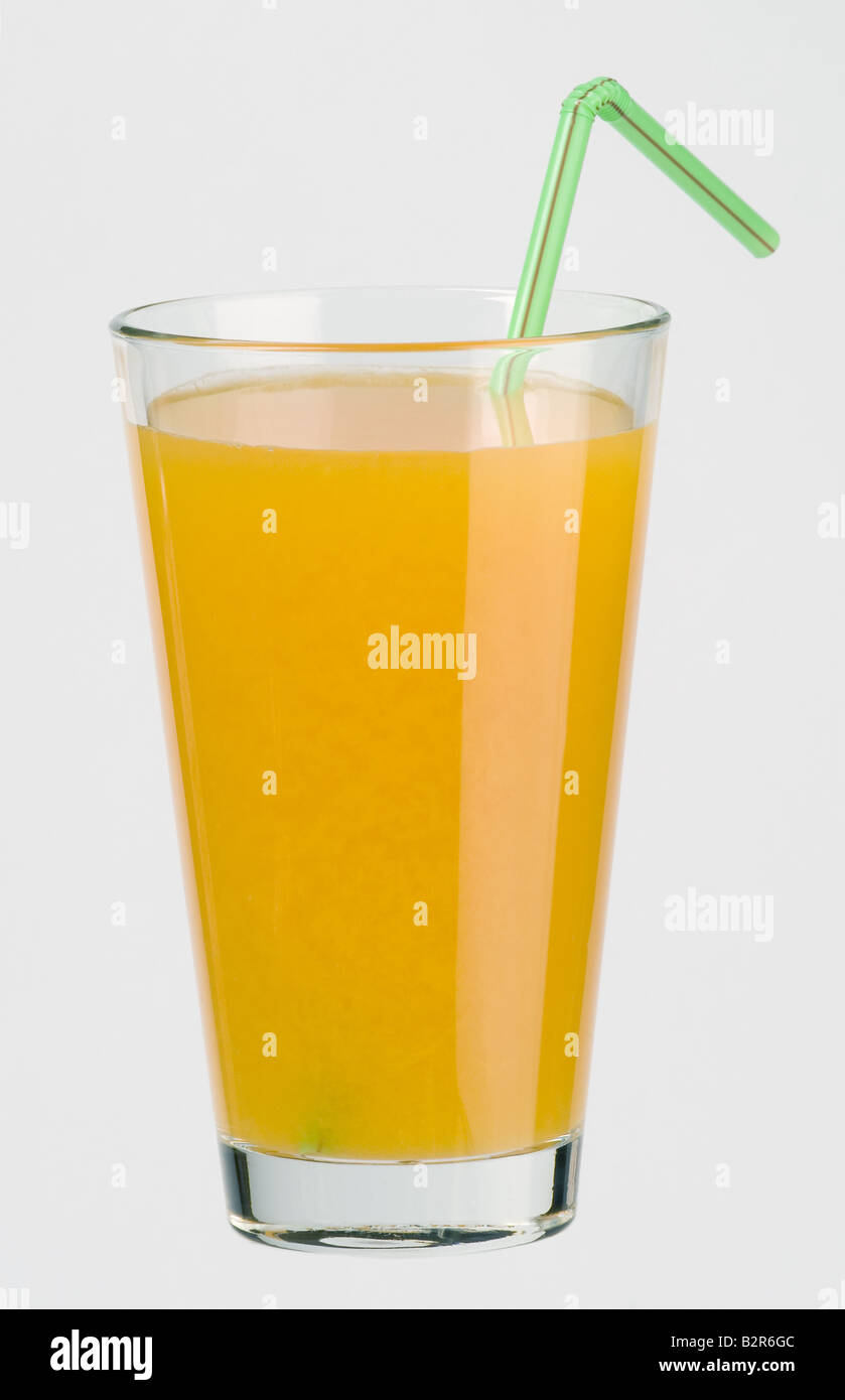 Glass of juice with a straw Stock Photo - Alamy