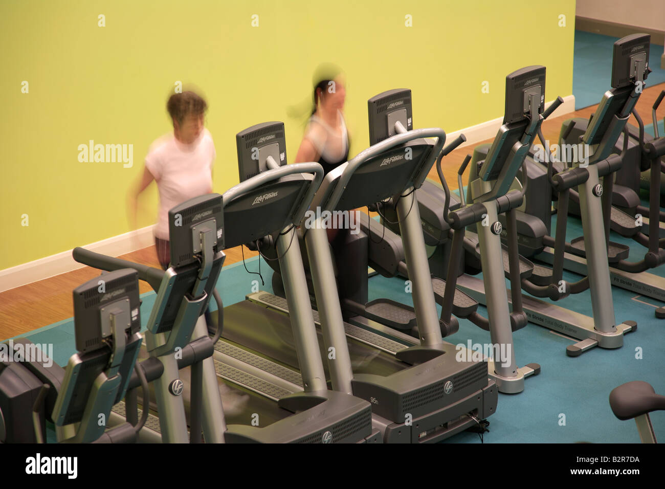 People running on treadmills blurred hi-res stock photography and ...