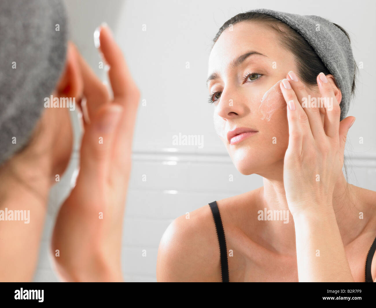 Lady putting on cream hi-res stock photography and images - Alamy