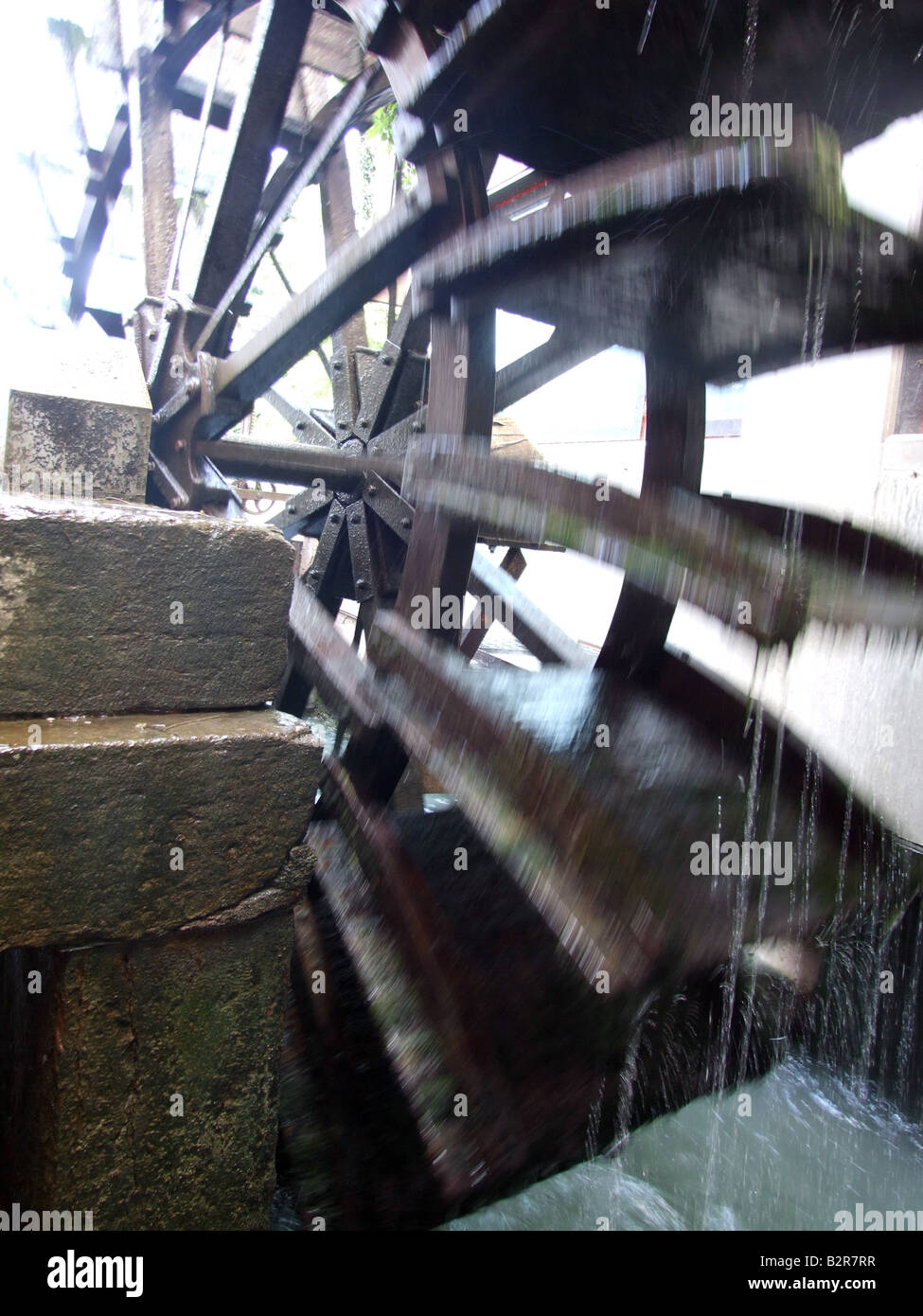 energy making industrial water wheel in action Stock Photo - Alamy
