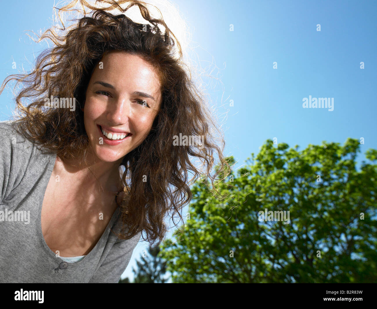 Woman enjoying the sun Stock Photo - Alamy