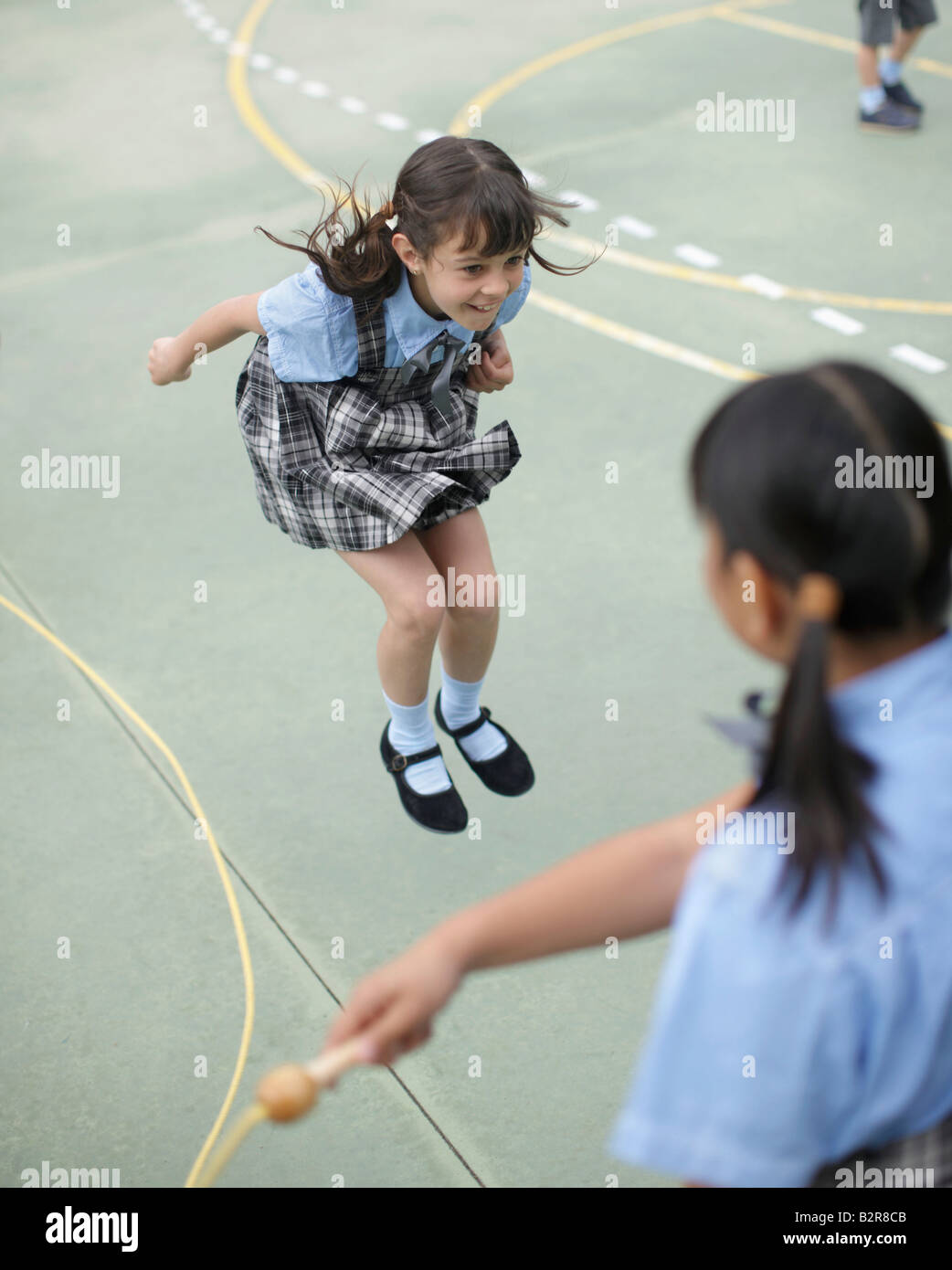 School girl skipping rope Stock Photo - Alamy