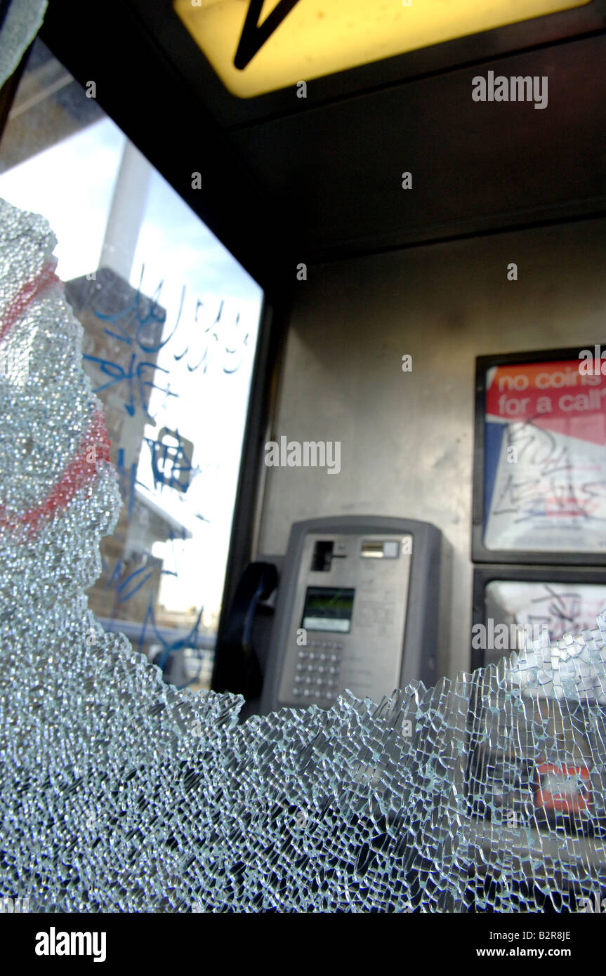 smashed telephone kiosk Stock Photo - Alamy