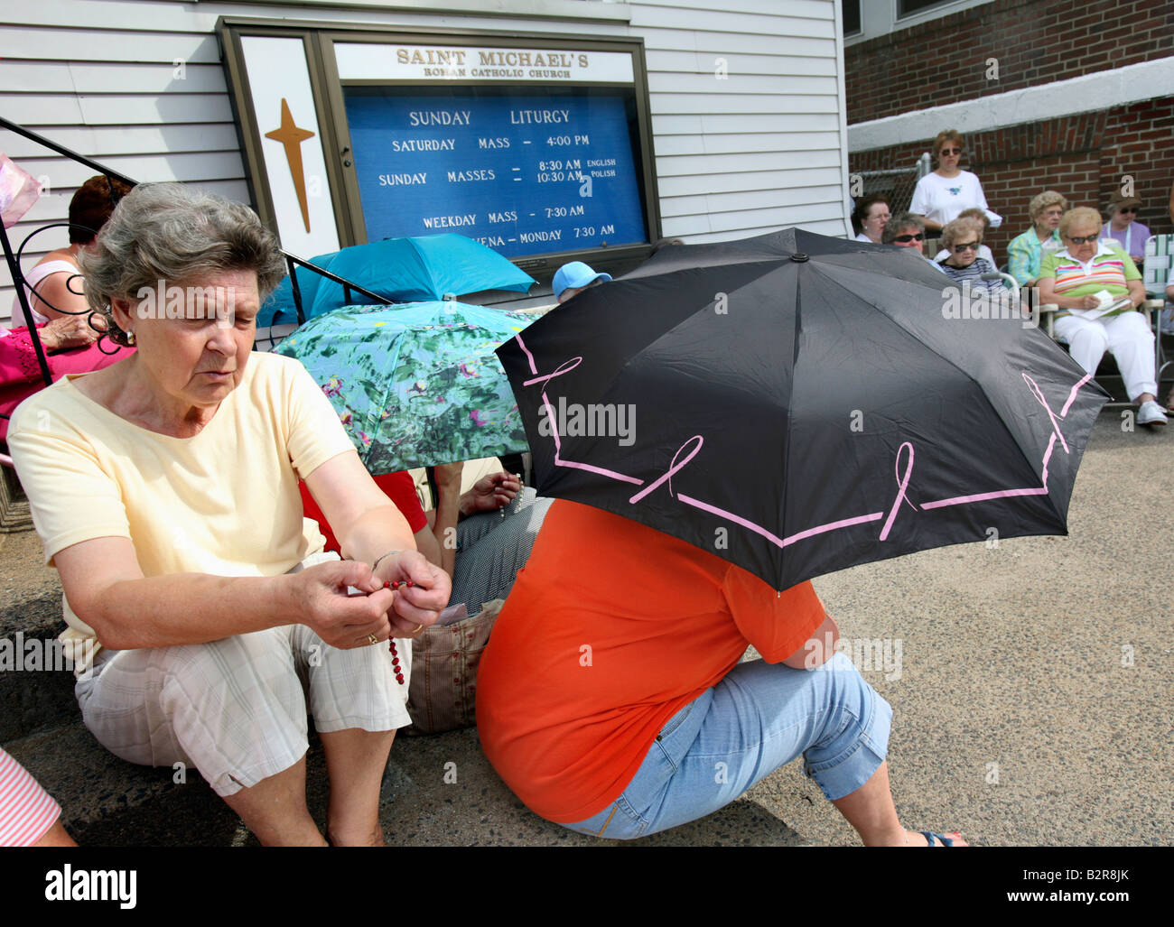 Women pray outside a Roman Catholic church in an attempt to stop its ...
