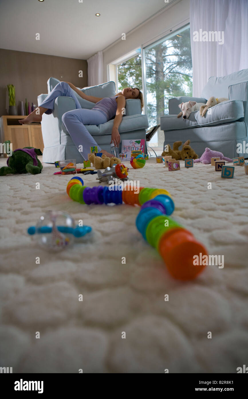Young mother and dog sleeping on chairs Stock Photo - Alamy