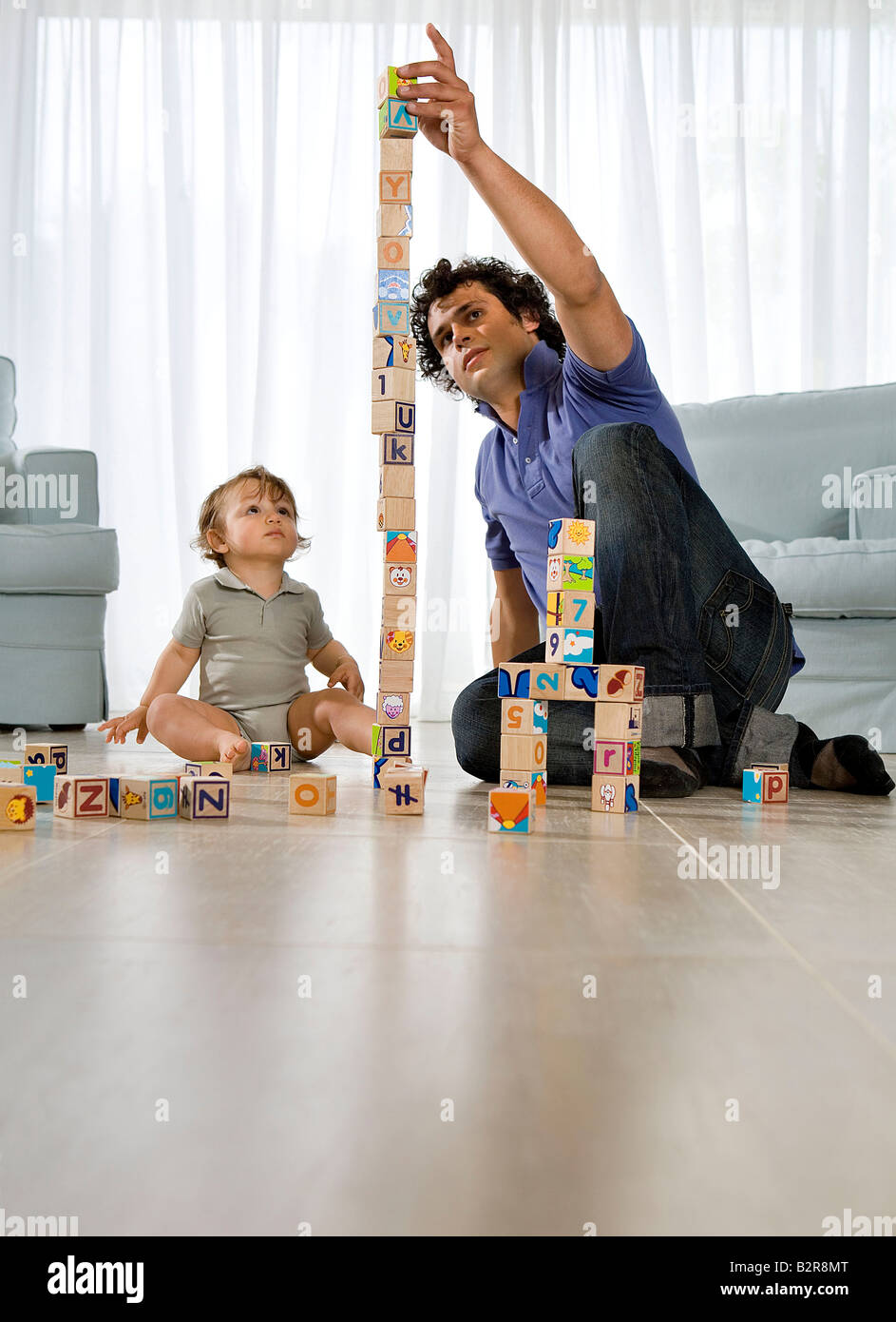 Wooden building block tower hi-res stock photography and images - Alamy