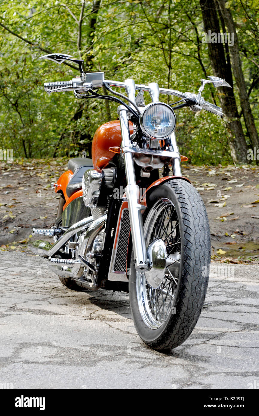 motorcycle on a road in the forest Stock Photo - Alamy