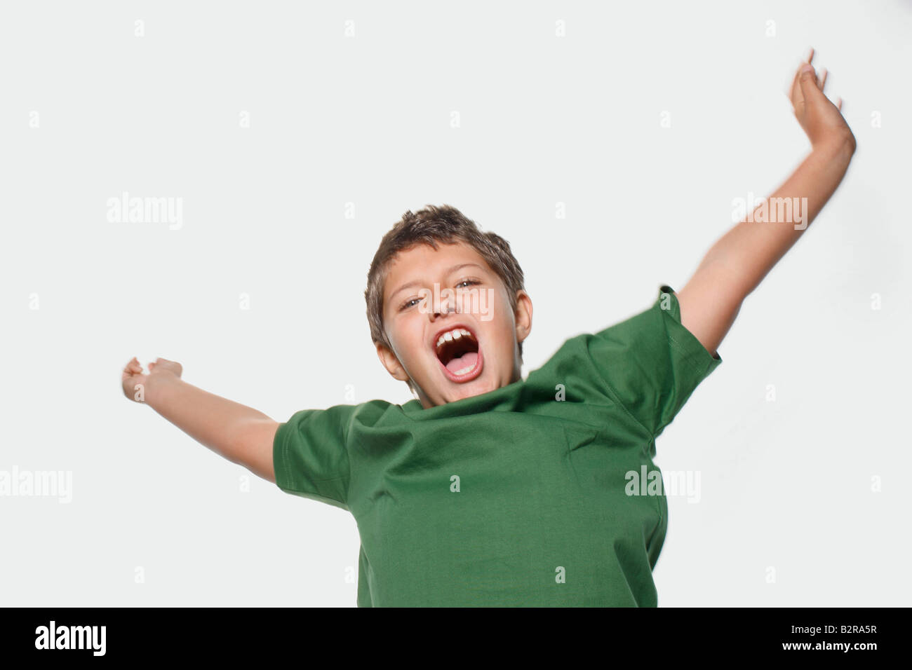 Young boy jumping and shouting Stock Photo - Alamy