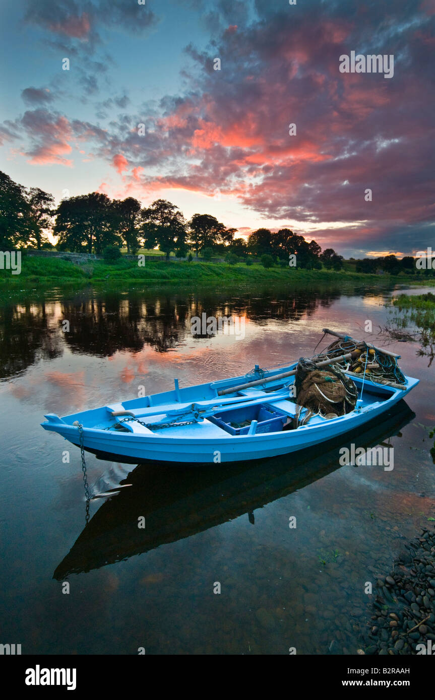A traditional salmon fishing boat (coble) on the River Tweed Stock ...