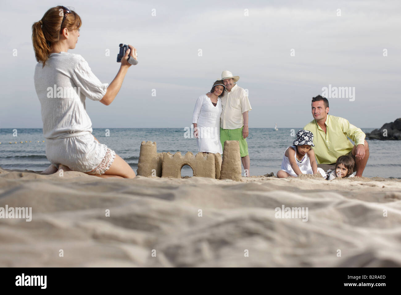 Multi generational family on beach High Resolution Stock Photography ...