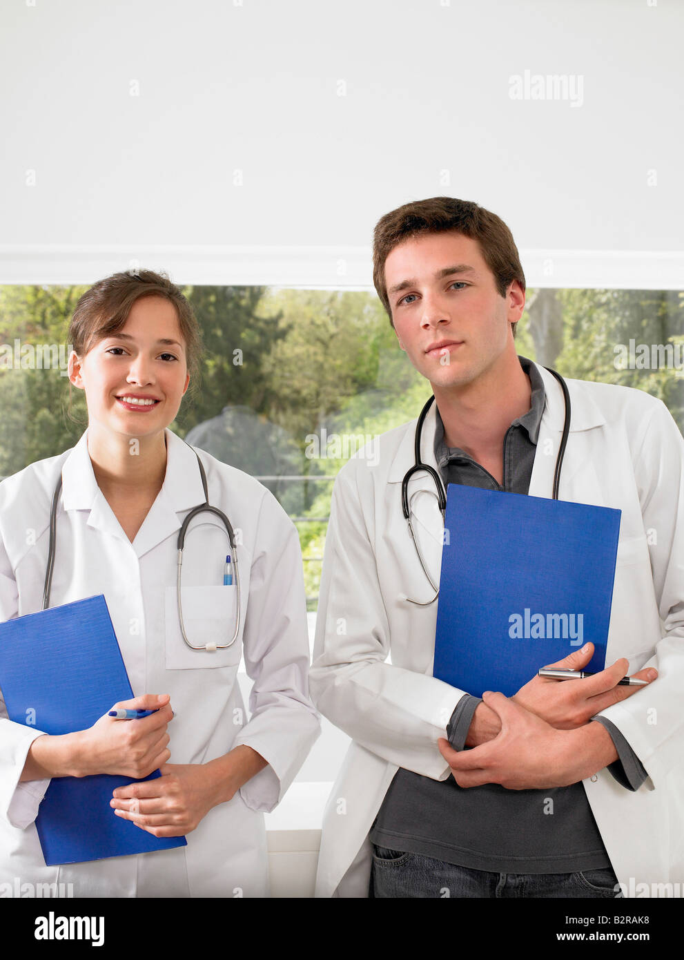 Doctors holding files Stock Photo - Alamy