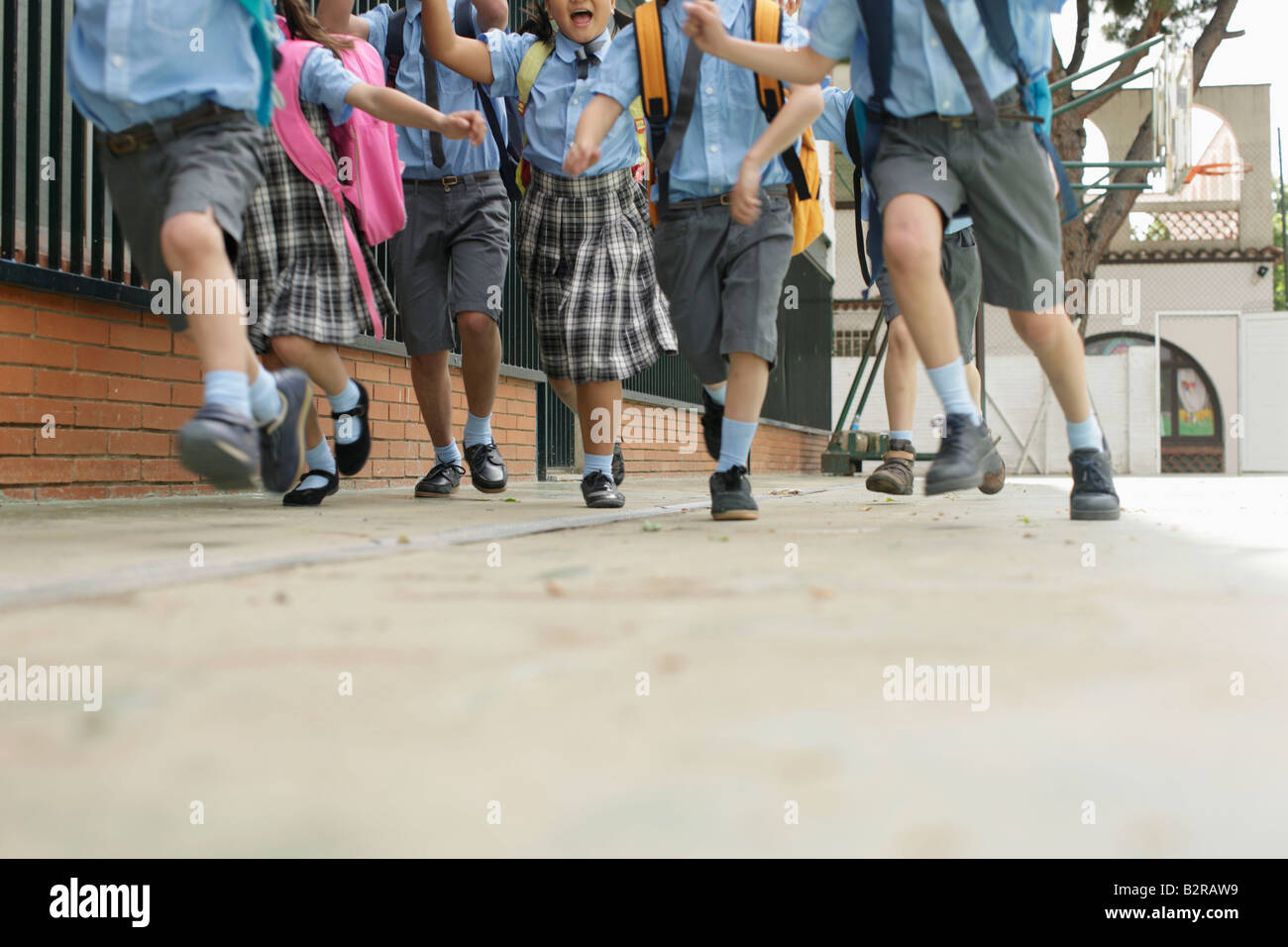 School children running low angle Stock Photo - Alamy