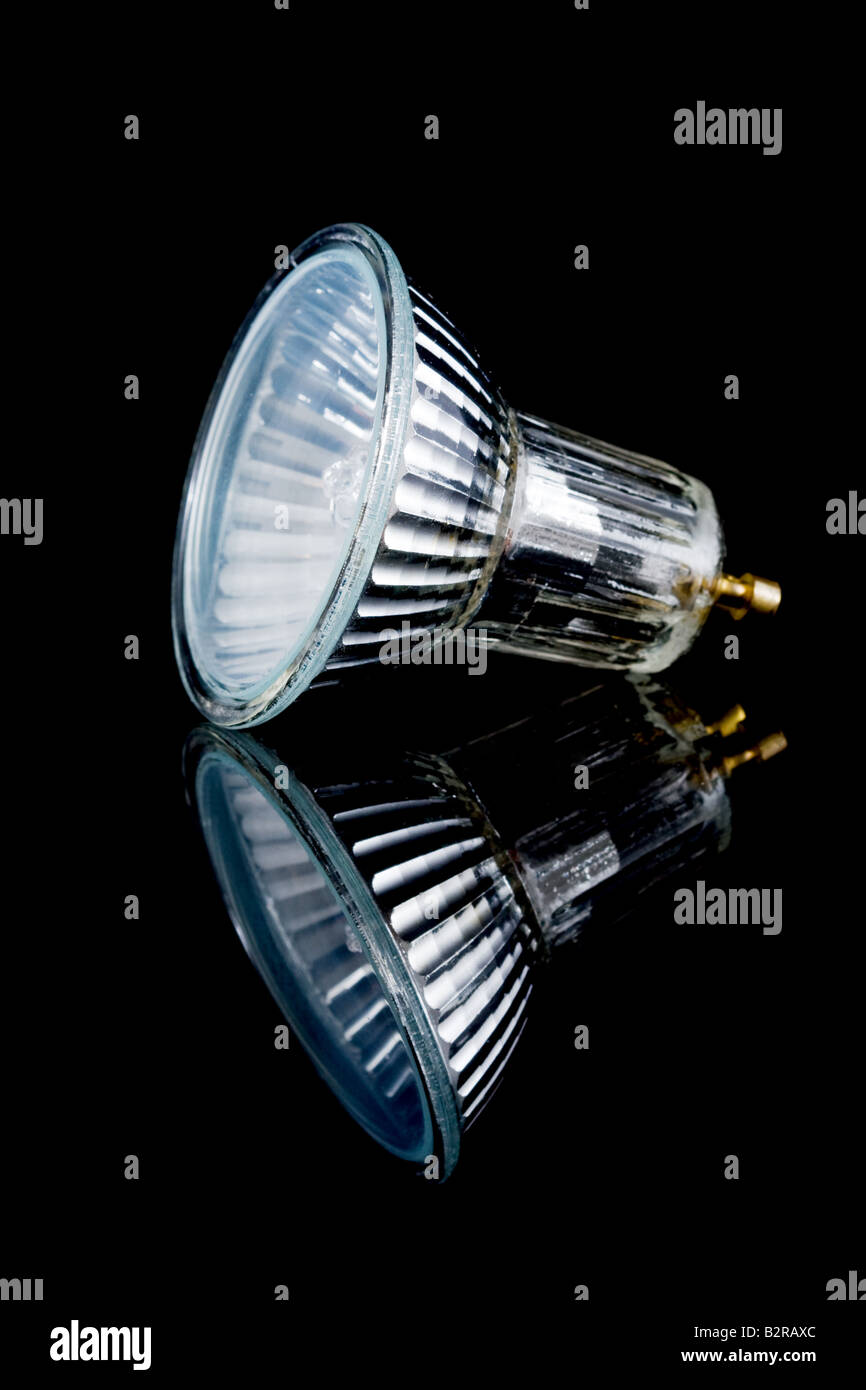 small halogen lightbulb isolated on black with reflection Stock Photo ...