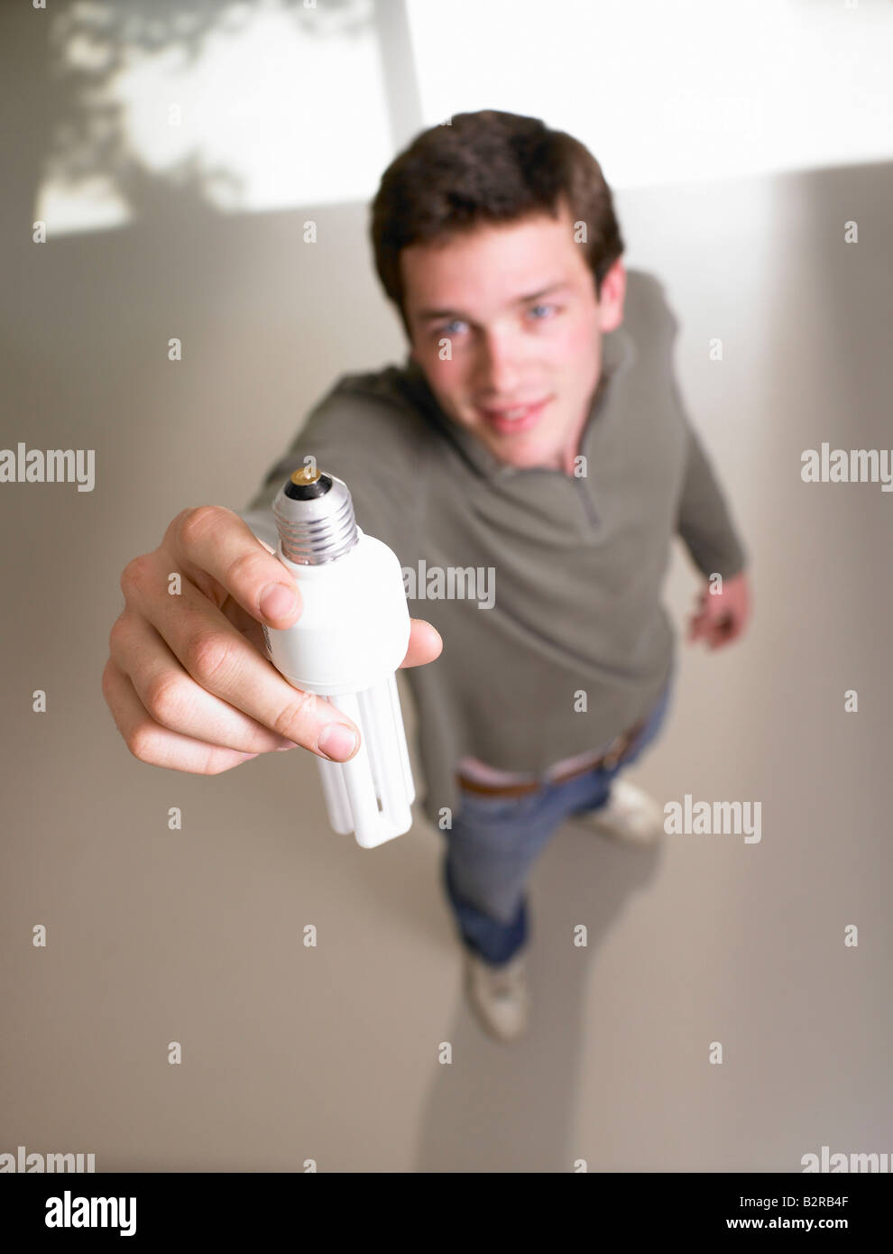 Man fixing a light bulb Stock Photo - Alamy