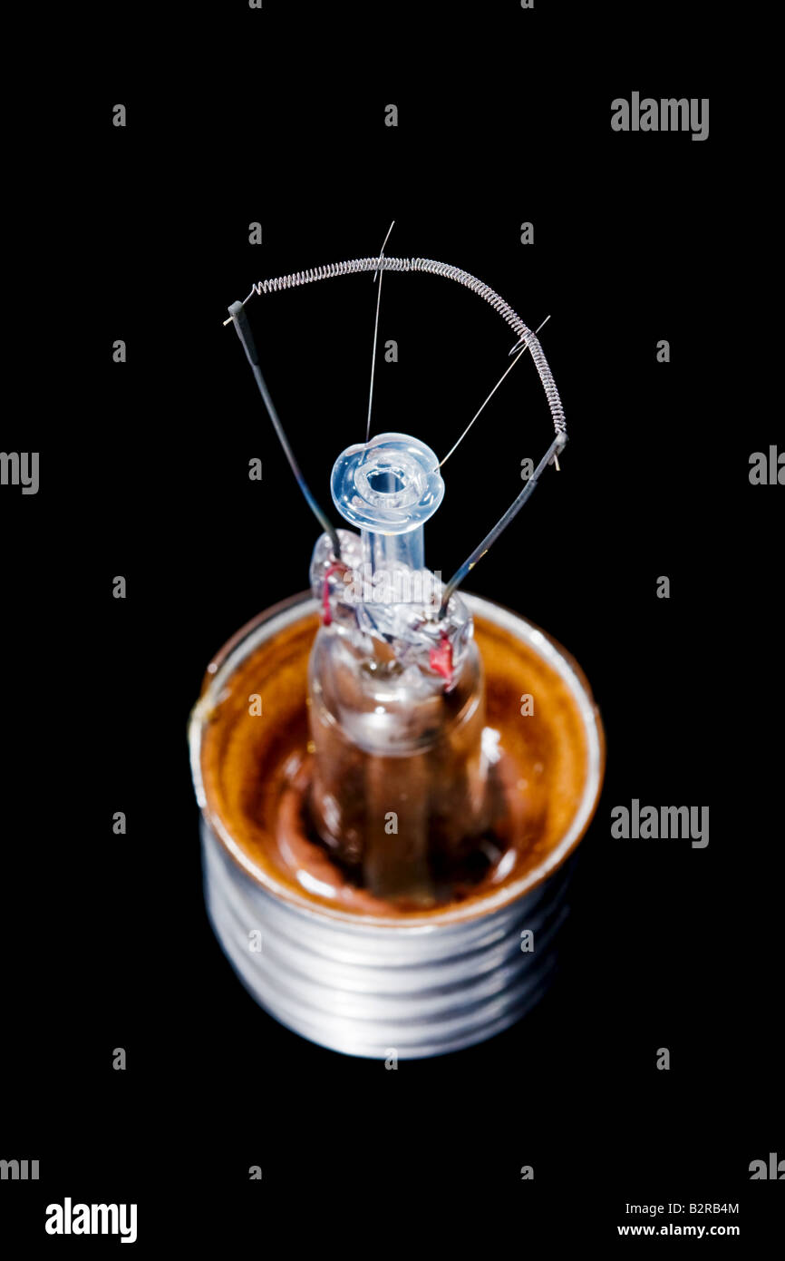 broken lightbulb isolated on black background Stock Photo - Alamy
