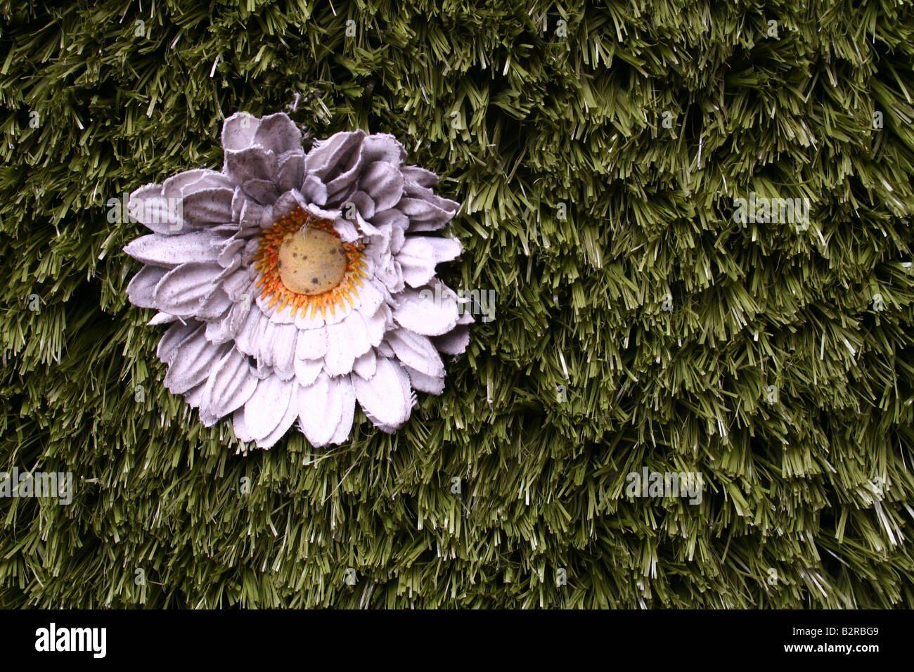 A van was covered in fabric daisies and grass Stock Photo - Alamy