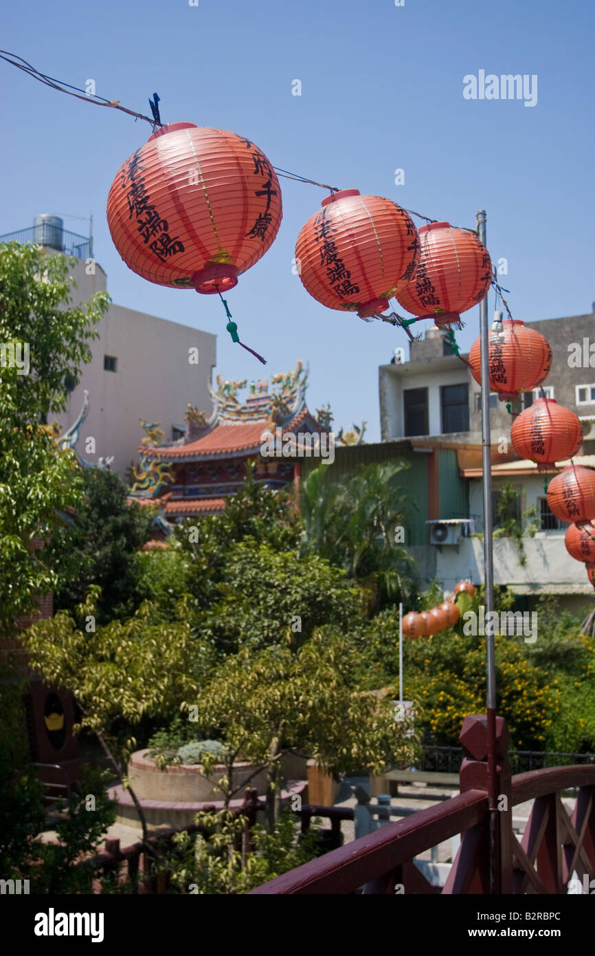 Taiwanese Chinese red temple lanterns hanging in the breeze outside ...