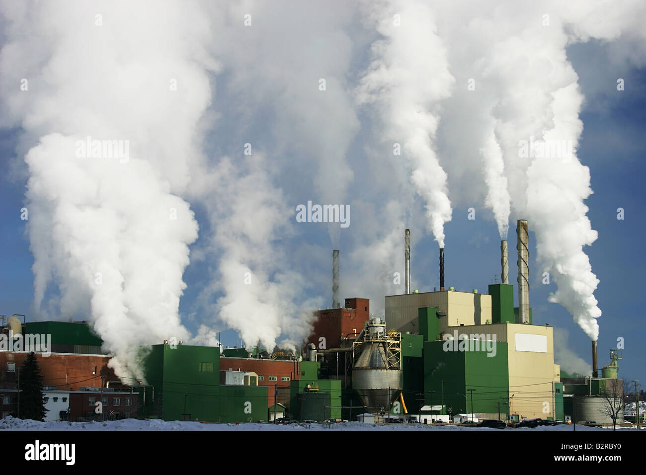 This is a paper mill producing a lot of smoke Stock Photo - Alamy