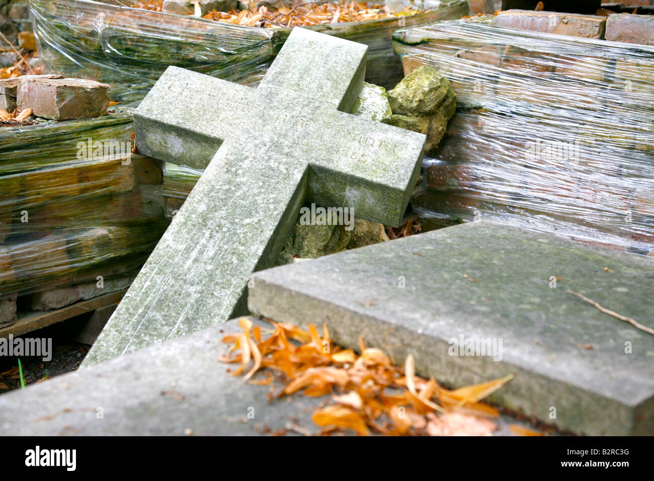 An old crucifix which has fallen from its Grave Stock Photo - Alamy