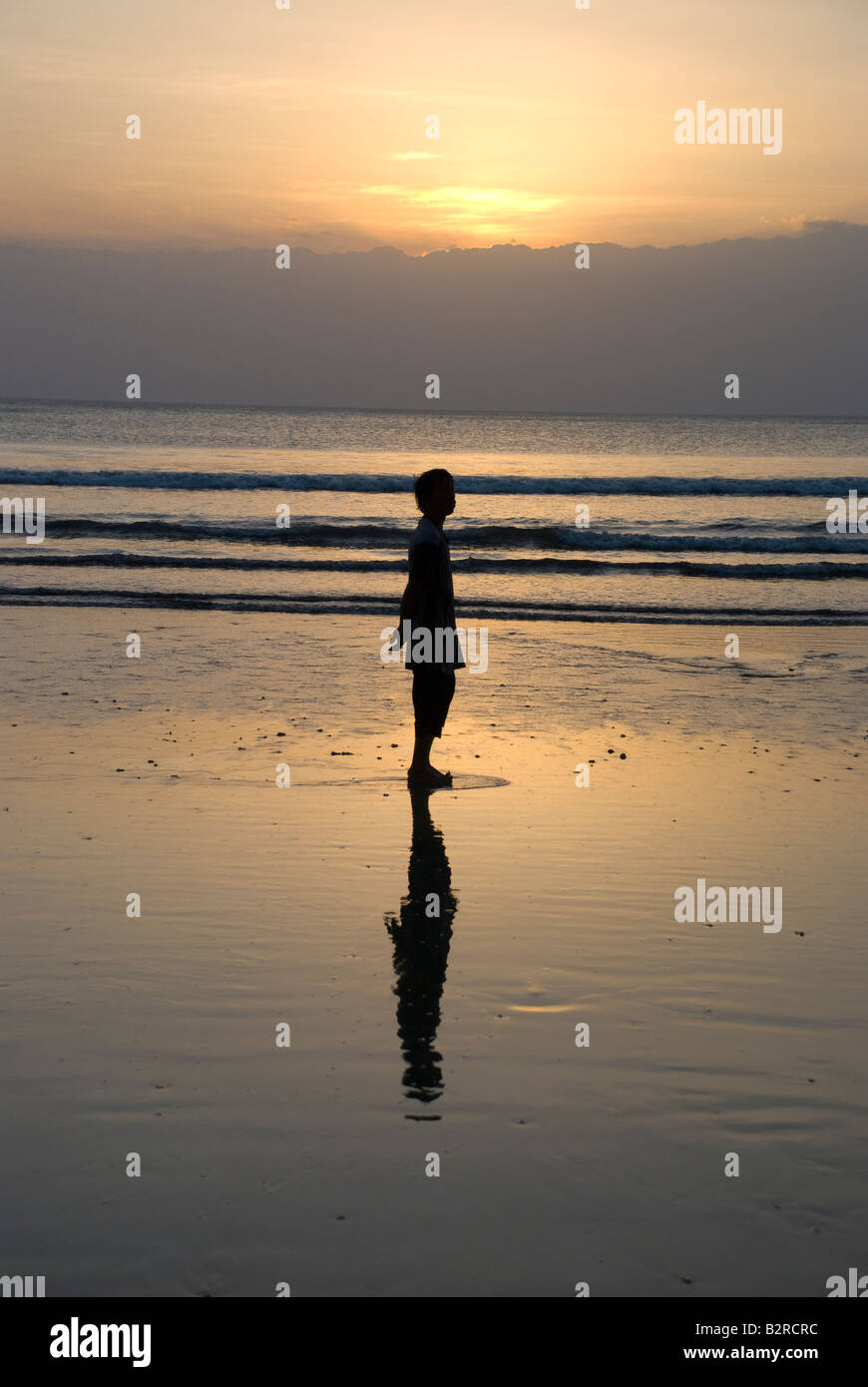 kuta bali indonesia beach bay sea ocean surf sunset man woman walk ...