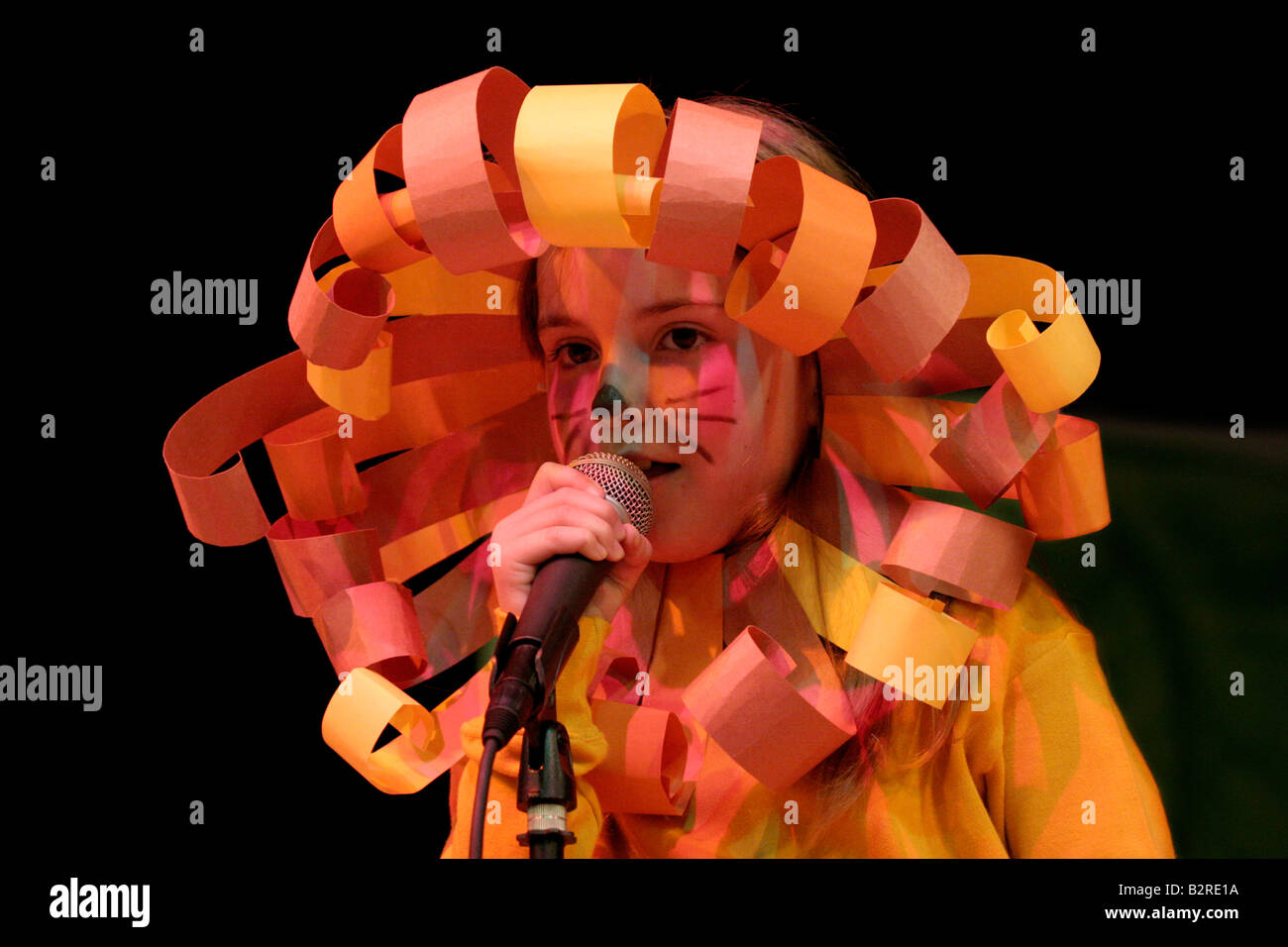 First Grade Student Sings at School Performance Stock Photo - Alamy