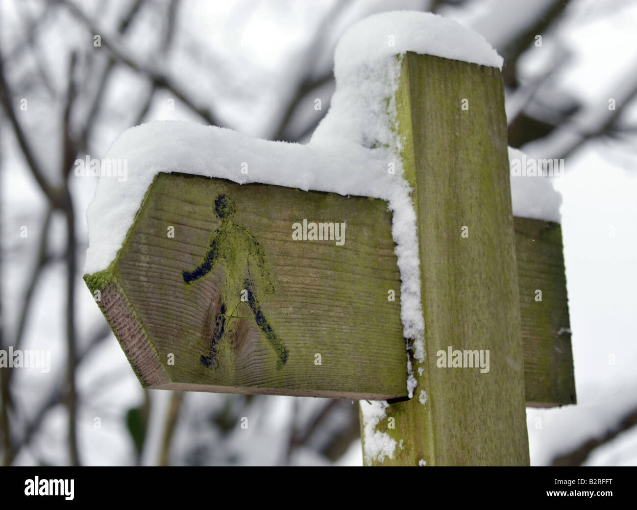 Snow covered wooden footpath sign, Teme Valley, Worcestershire Stock ...