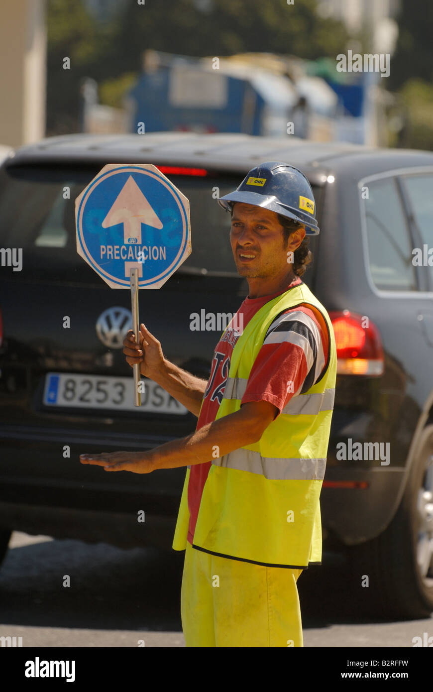 Highway construction worker controlling traffic flow Stock Photo - Alamy