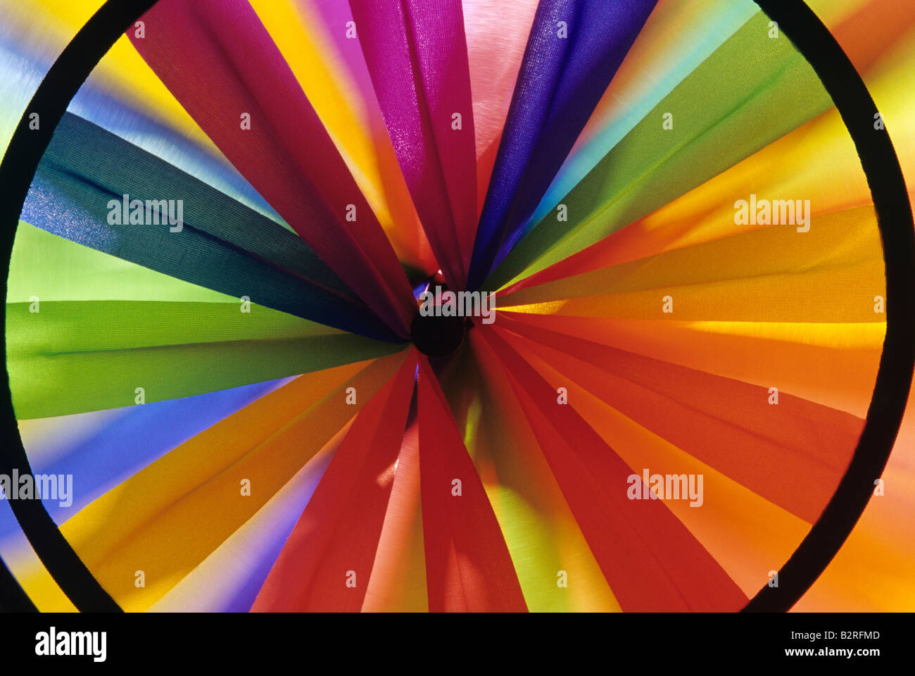 Multi colored close up of a pinwheel in motion Stock Photo - Alamy