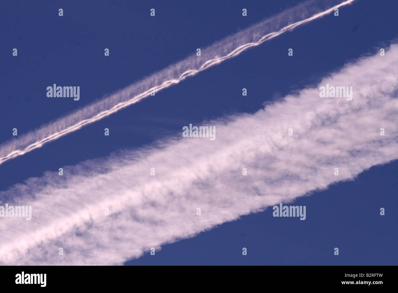 Picture of Aeroplane Jet Tails in the sky Stock Photo - Alamy