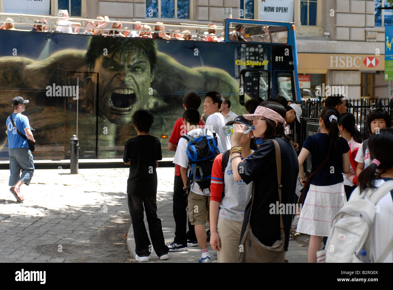 A sightseeing bus with an advertisement for The Incredible Hulk movie ...
