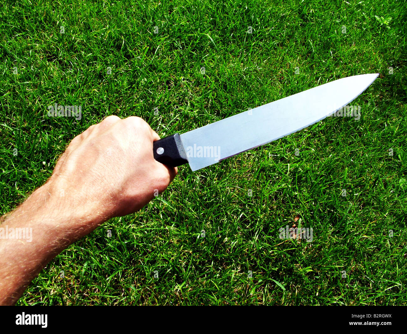 Hand holding stabbing knife hi-res stock photography and images - Alamy
