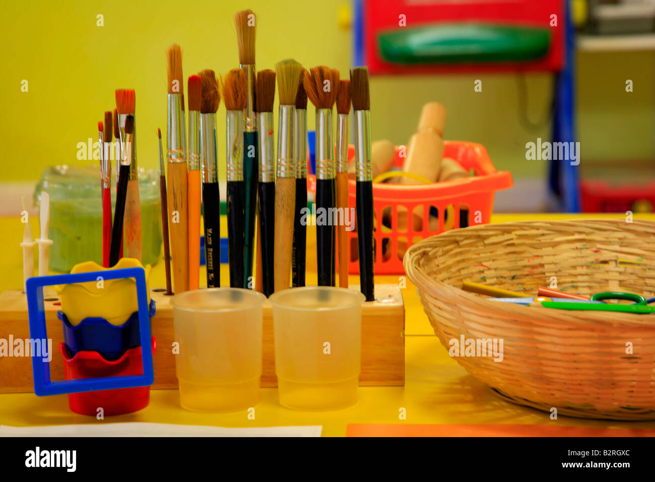 Paint brushes and craft materials in a school classroom artist brushes ...