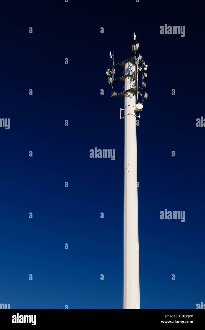 White steel microwave radiation cell phone telecommunications tower ...