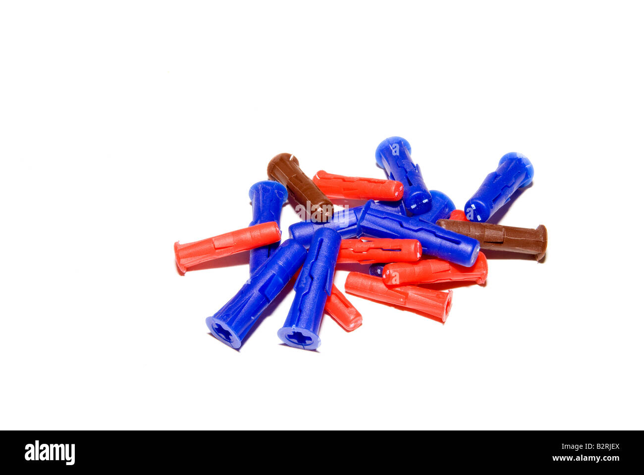 A pile of colored rawl plugs diy plugs wall plugs screw fixings ...