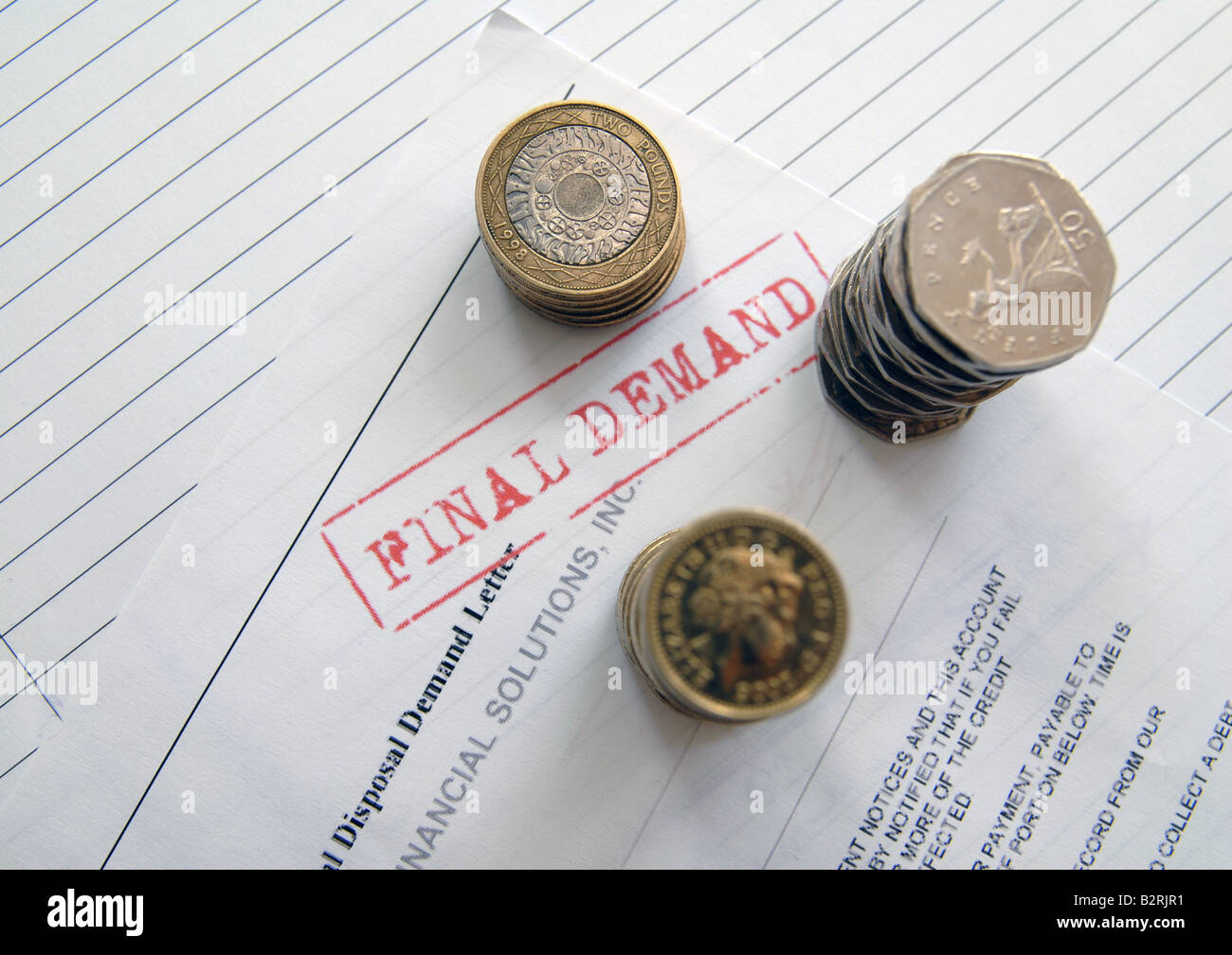 Doing the sums to pay a final demand bill final demand Stock Photo - Alamy