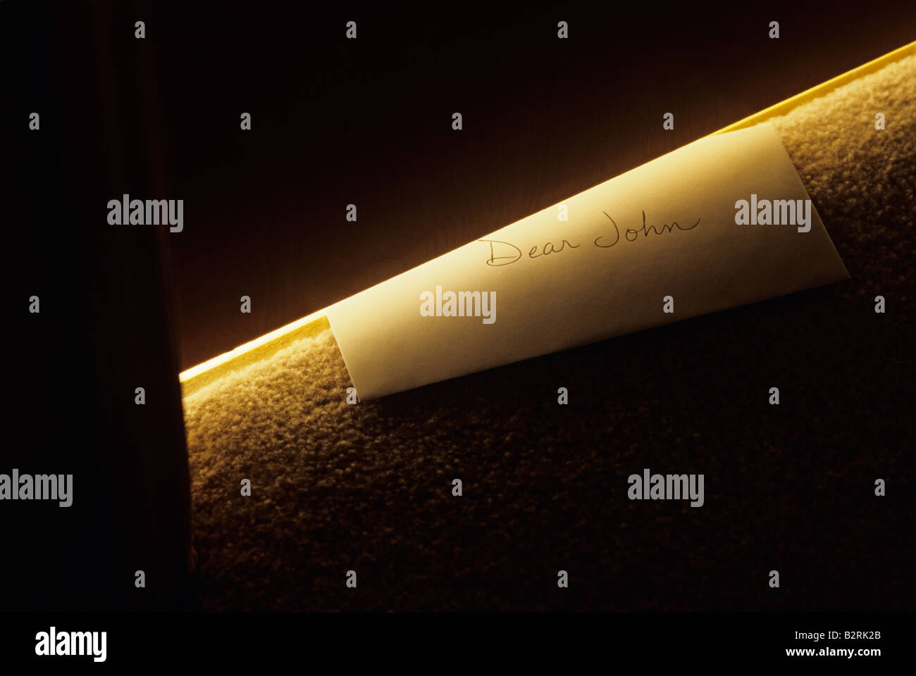 Door with envelope passed under the door Dear John notice on envelope ...